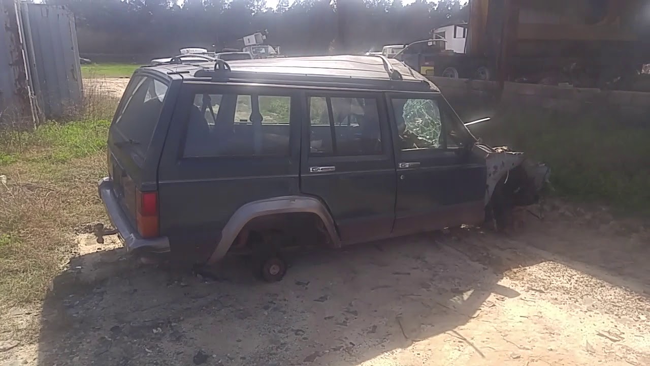 Taking a part off of wrecked Jeep in a junkyard part 1 - YouTube