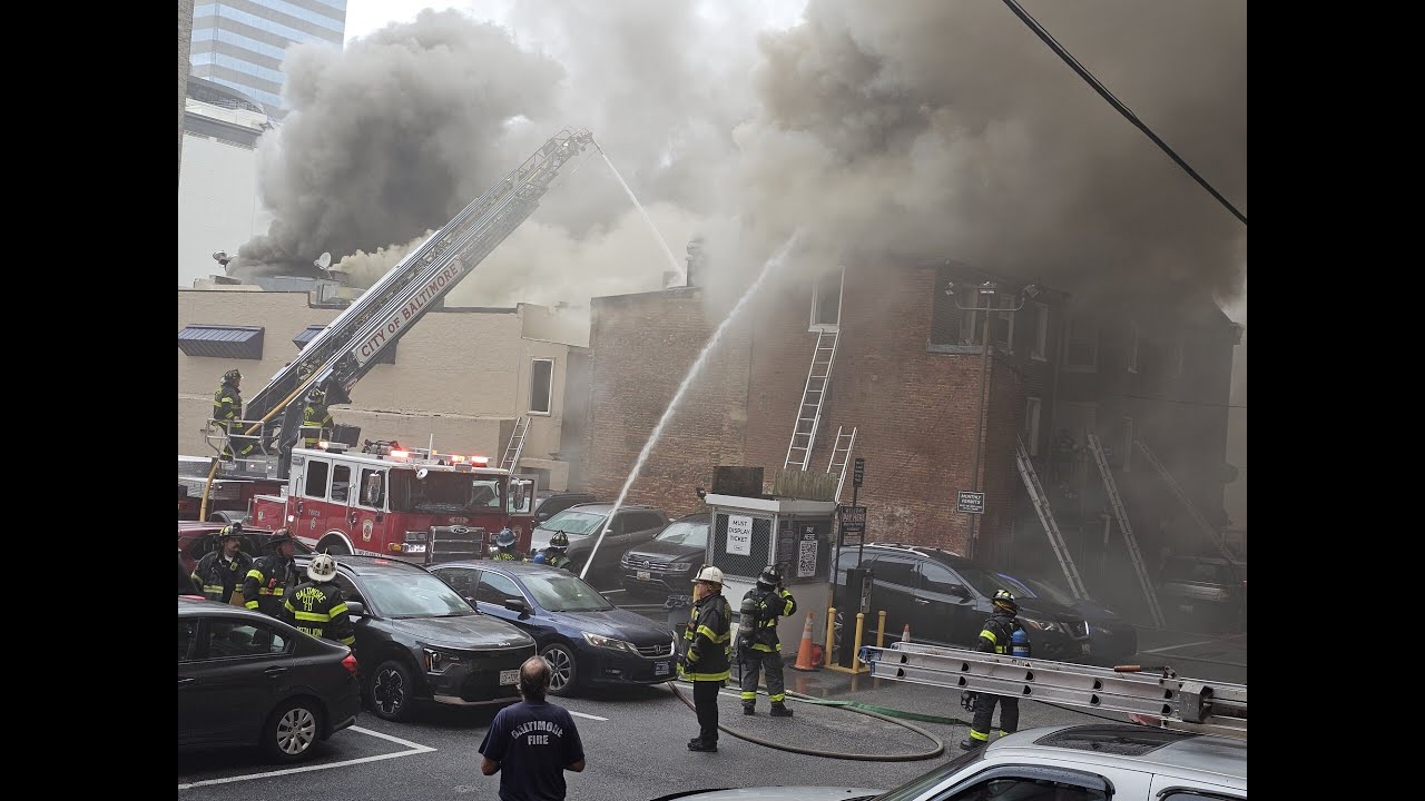 Baltimore City Fire officials battle a 5 alarm building fire Sunday ...
