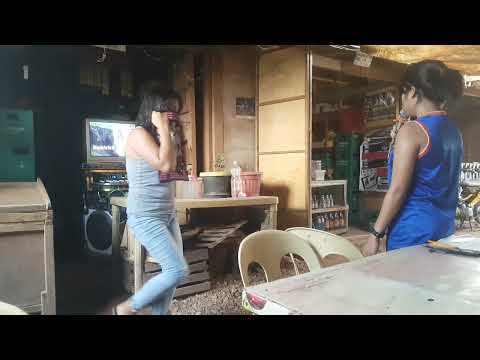 Local Filipina sexy girls - waitresses sing and dance in Karaoke bar Coron Island - The Philippines