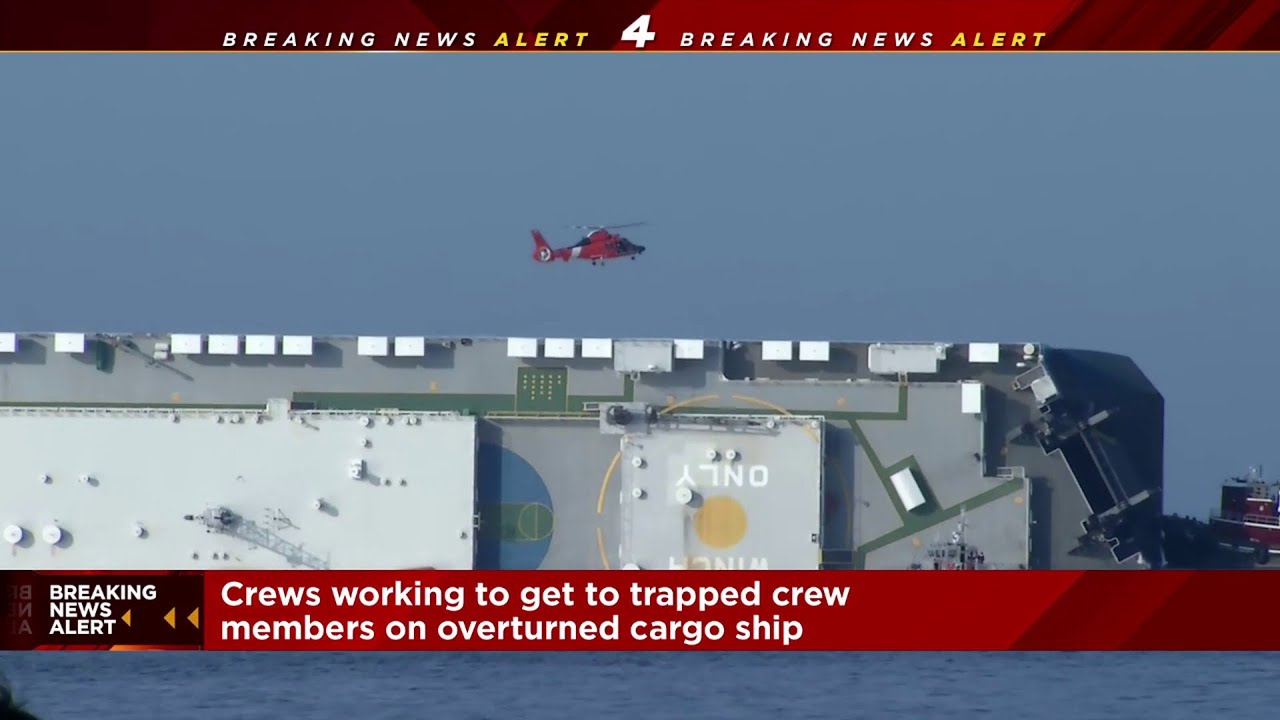 The Coast Guard just landed on the cargo ship that flipped on its side ...