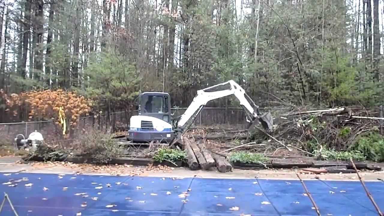 Mini Excavator Clearing Shrubs - YouTube