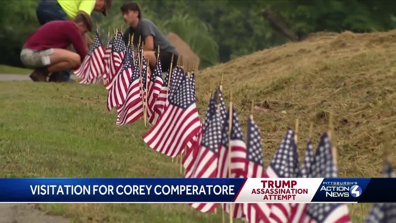 Community members place flags ahead of visitation in honor of Corey ...