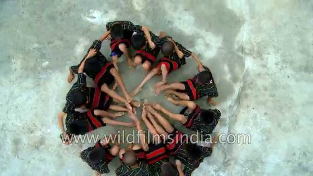 Mizo children in traditional puanchei and ngotekherh display a game ...