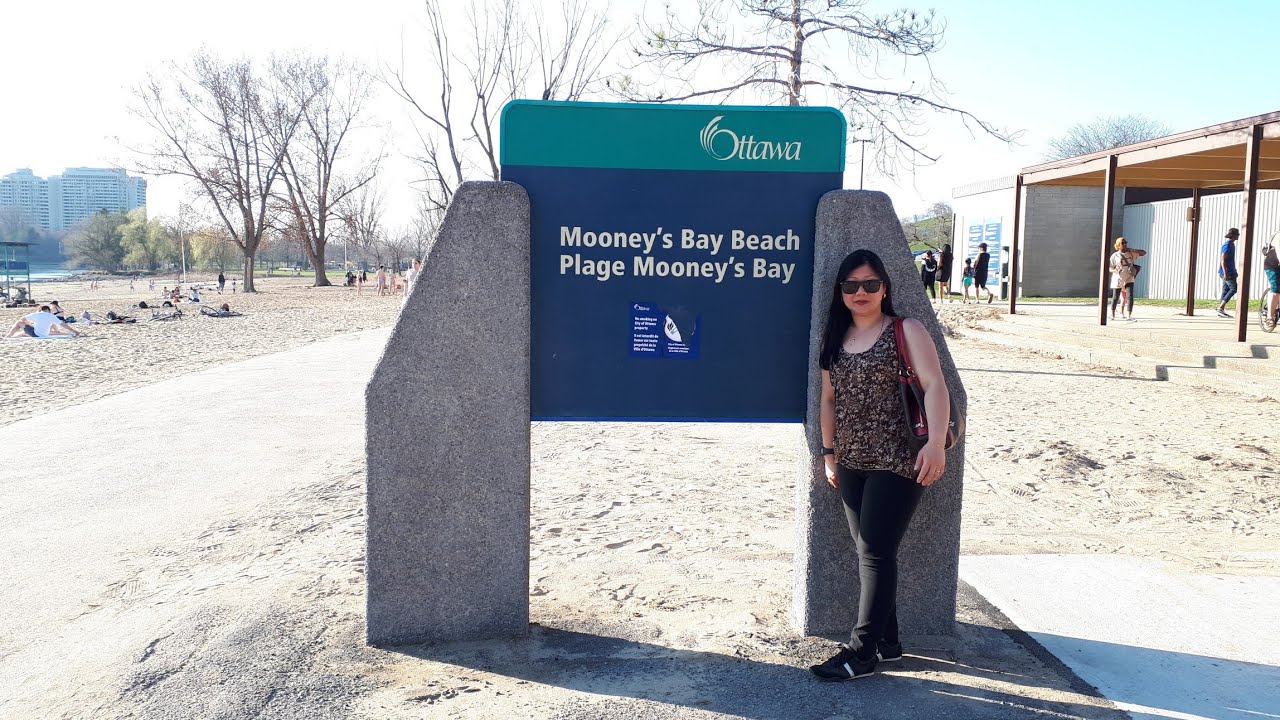 Enjoying the good weather at Mooneys Bay beach - YouTube