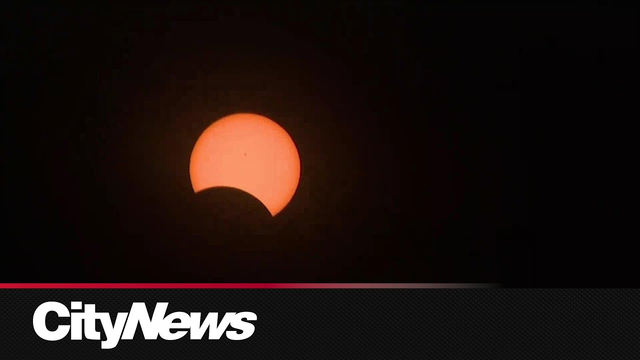 Edmontonians watch solar eclipse - YouTube