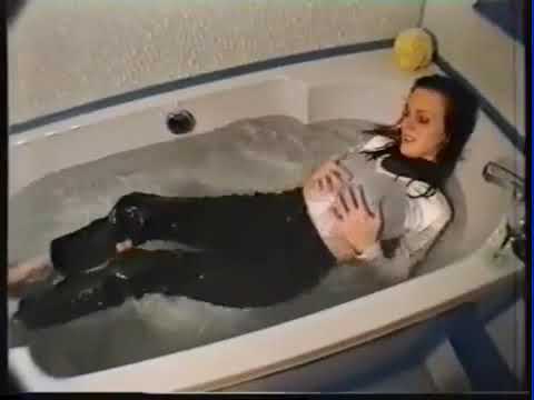 049 Wetlook Hot Girl in bathtub bathing in clothes