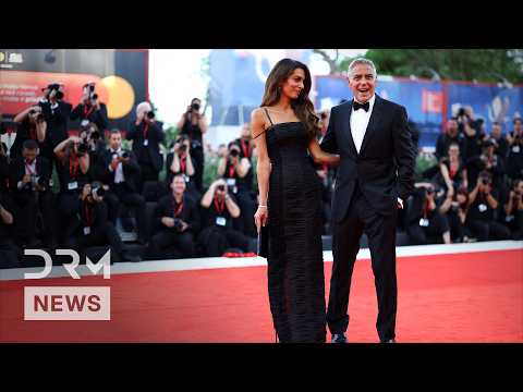 George and Amal Clooney Greet Fans and Sign Autographs on Venice Film Red Carpet | AA1G