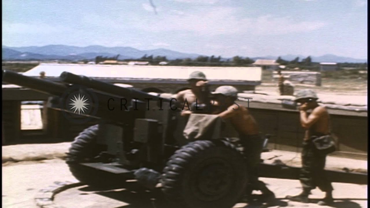 ROK (Republic of Korea) Tiger Division soldiers fire a 105mm howitzer ...
