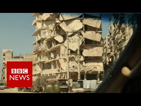Syria ceasefire: Devastation on road into west Aleppo - BBC News