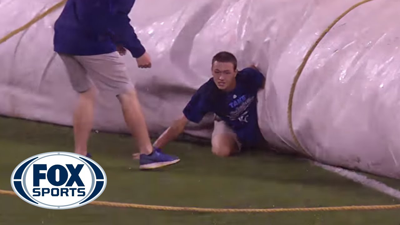 You need to see this Royals grounds crew member barely escape the tarp ...