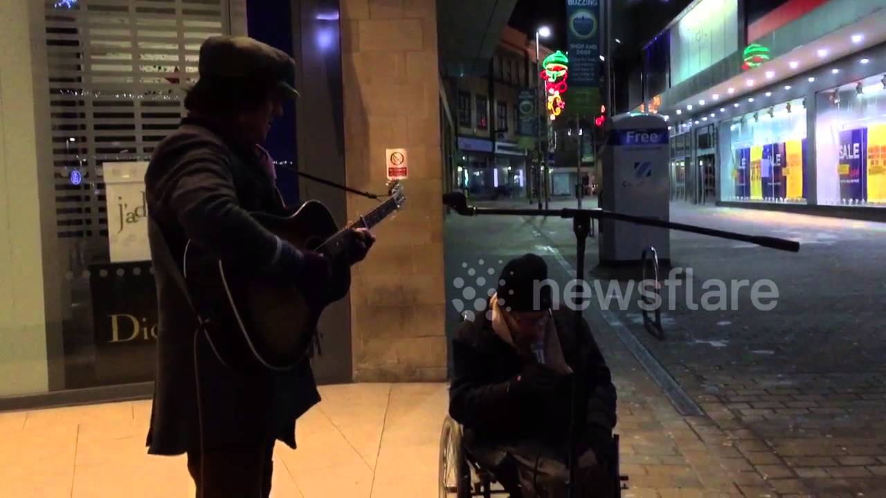 Homeless man joins busker in amazing spontaneous street jam - YouTube