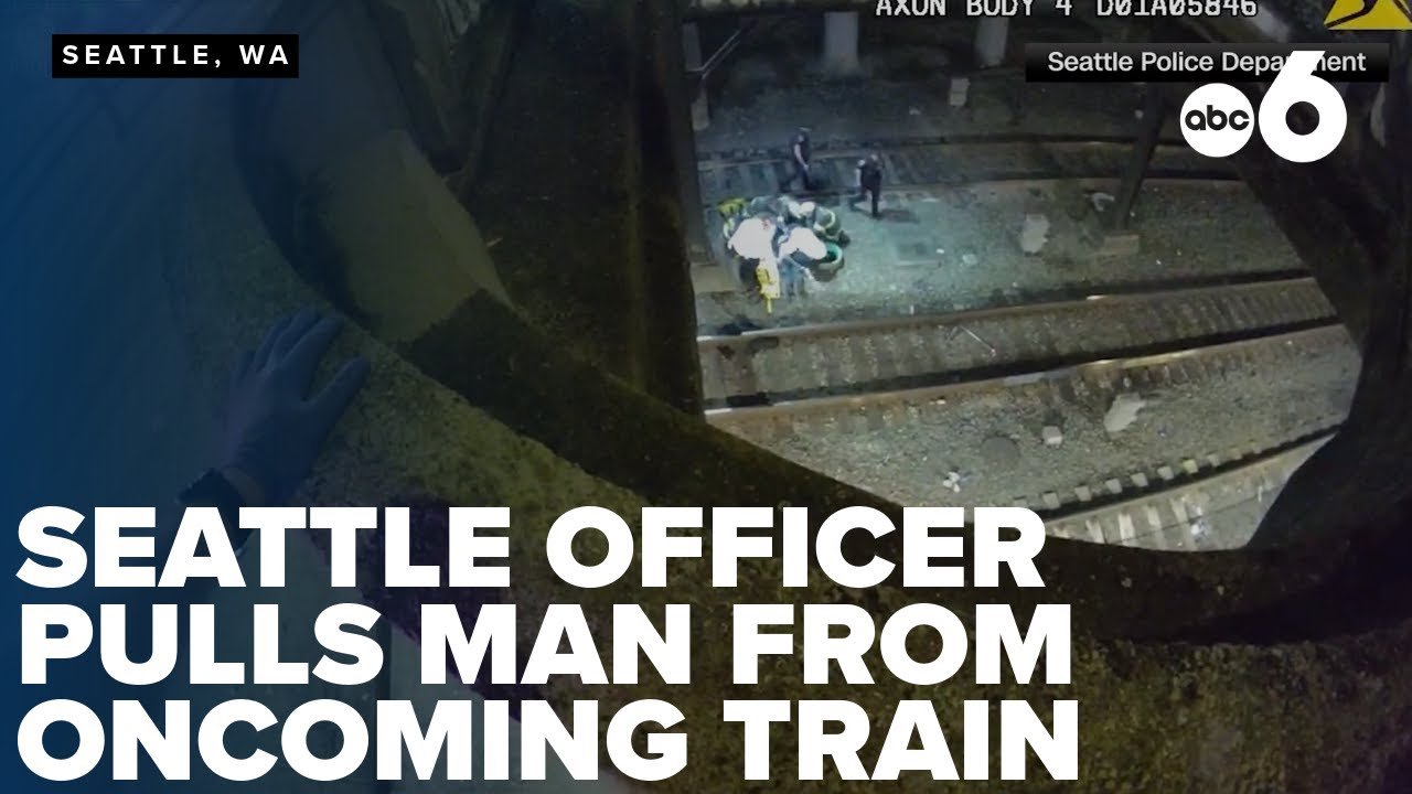 CAUGHT ON CAMERA: Seattle police officer pulls man away from oncoming ...