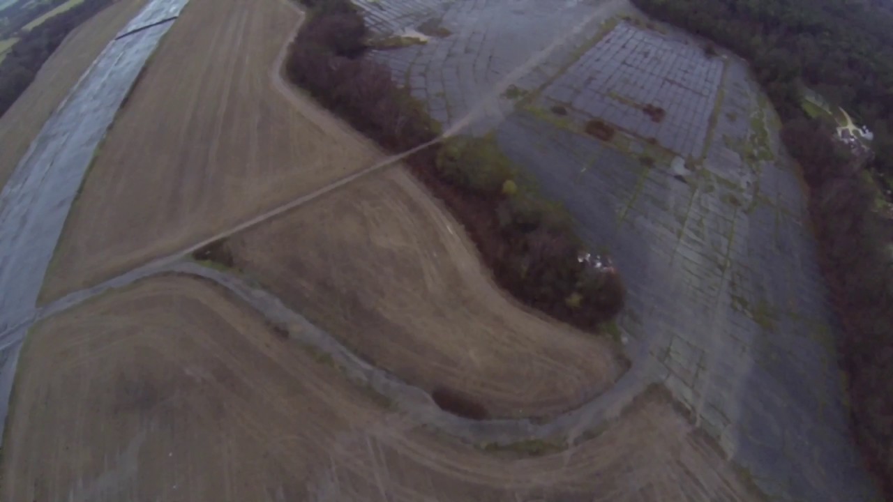 Razor 210 racing drone flying around abandoned airfield - YouTube