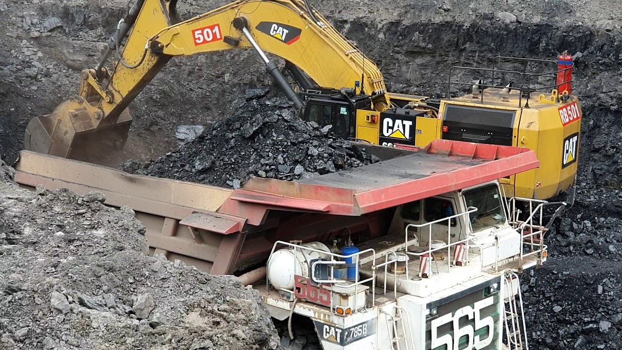 HMS CAT 6015B Loading Coal to OHT CAT 785 - YouTube