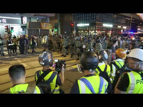 Protests disrupt Hong Kong work day as leader vows to remain