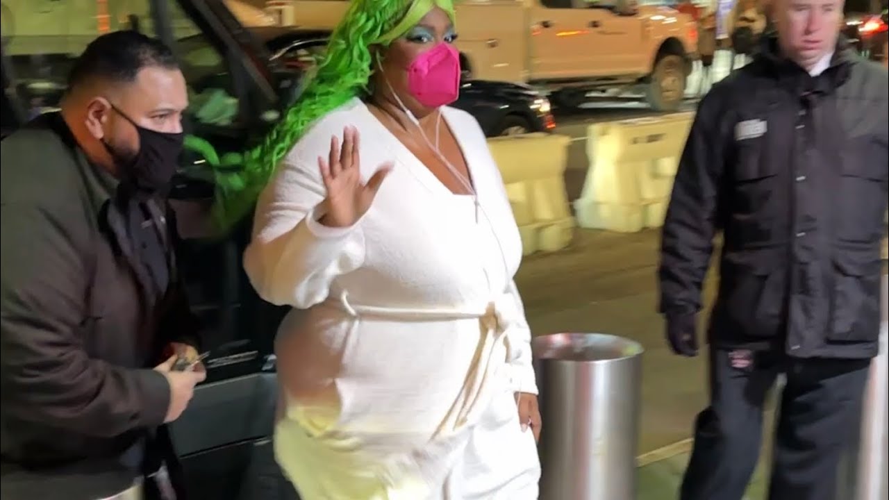 Lizzo runs in wearing a robe before Jingle Ball red carpet in NYC! # ...
