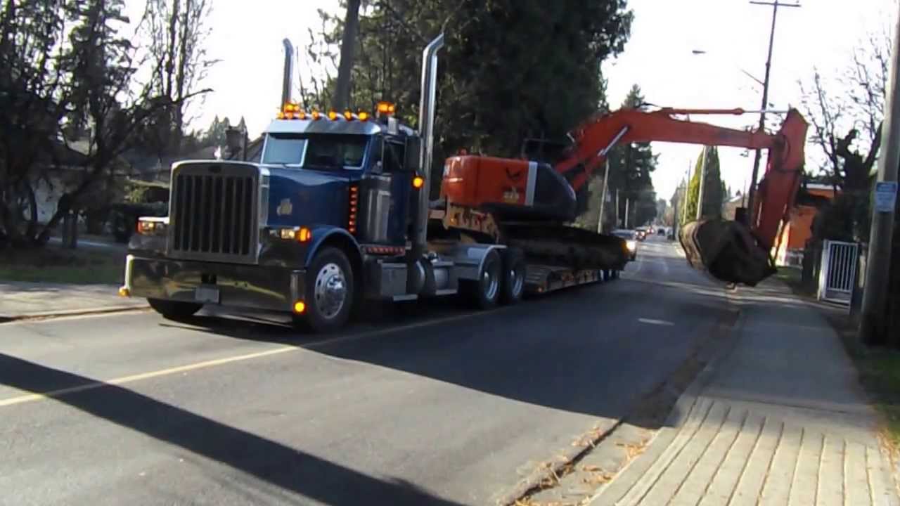 Loading an Excavator onto a flatbed - YouTube