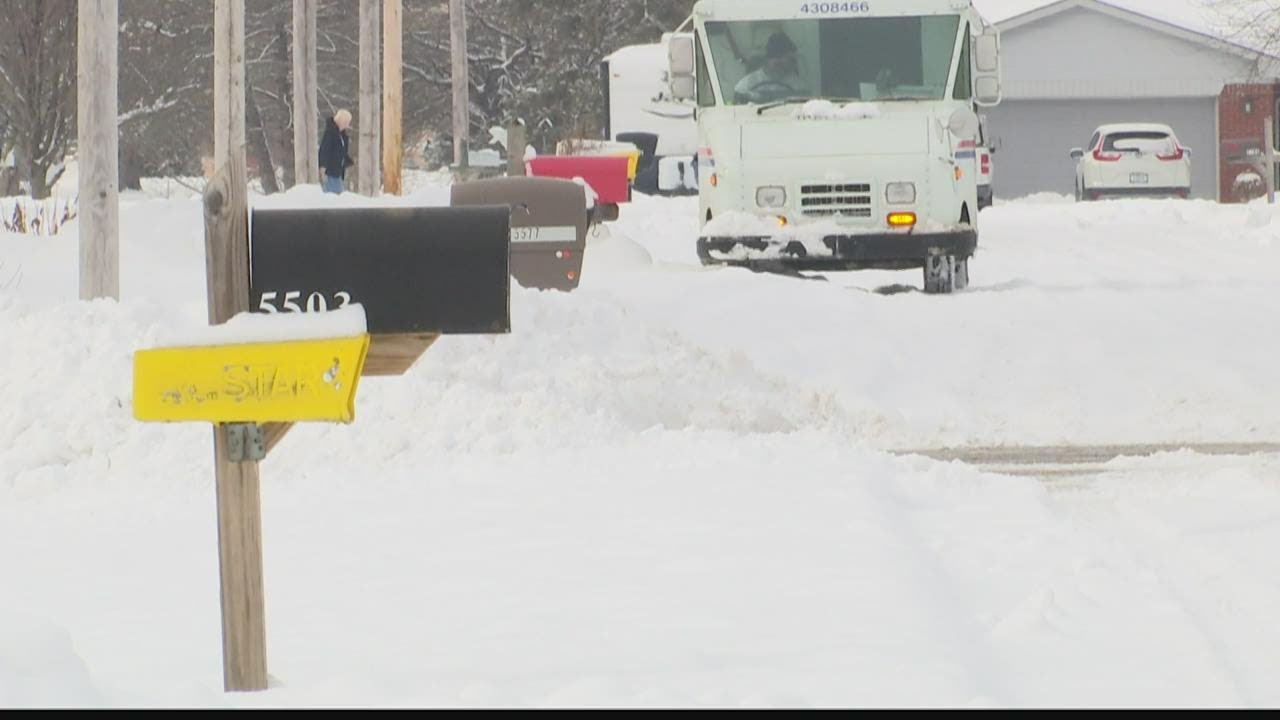 Snow slowing mail delivery - YouTube