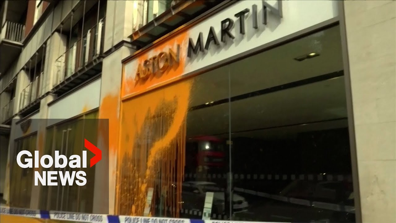 Climate protesters spray paint on Aston Martin showroom in London - YouTube