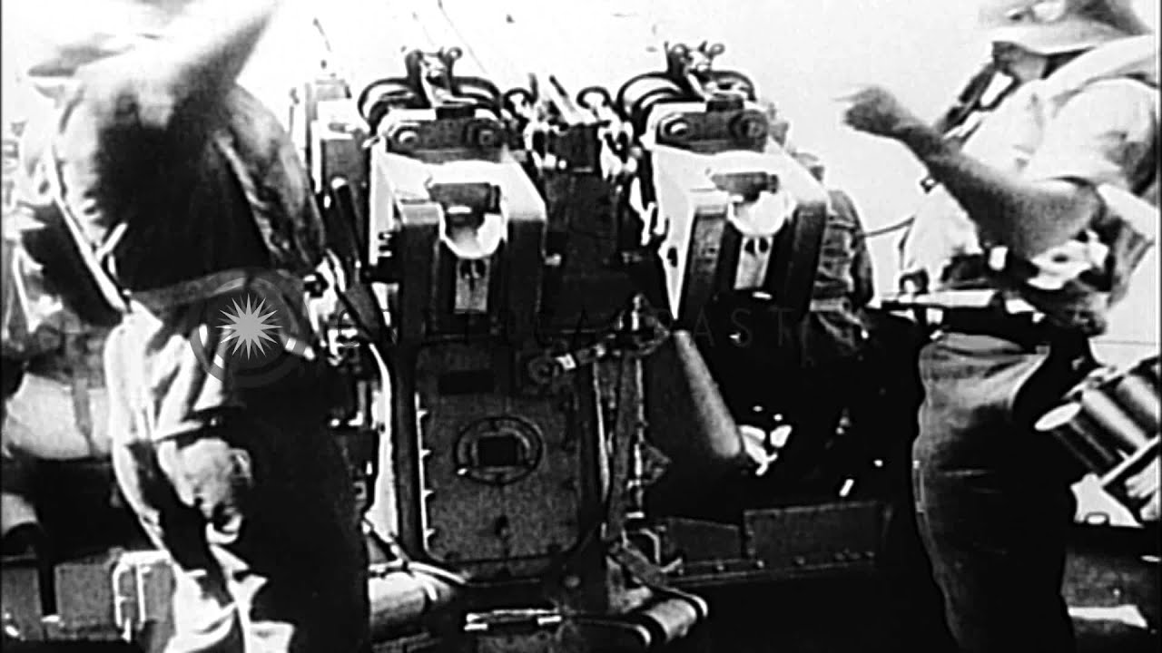 German navy sailors fire antiaircraft guns and prepare to submerge a ...