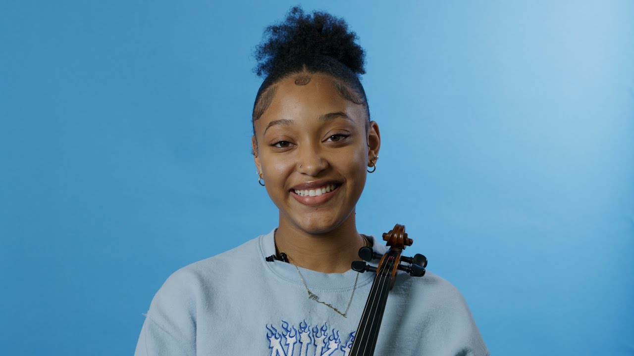 Student soloist, Madison Cole, reads comment cards from her Seattle ...