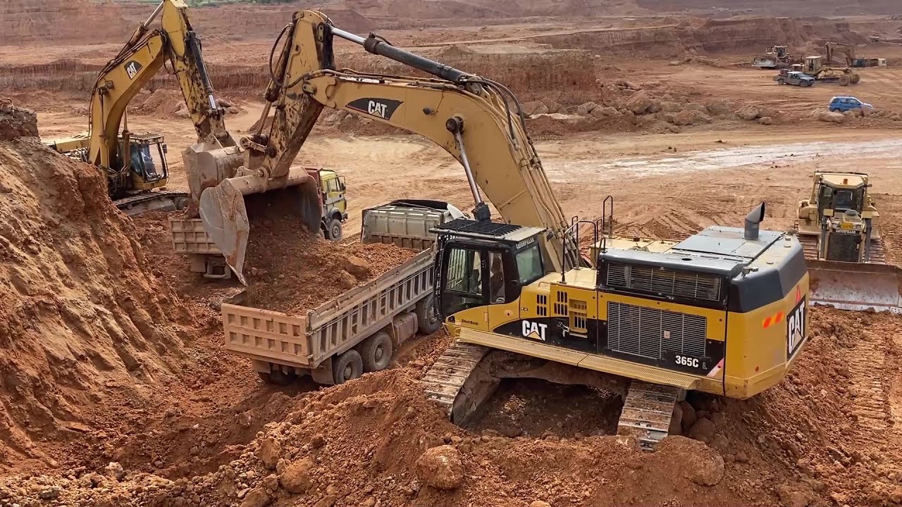 Caterpillar 365C Excavators Loading Mercedes & MAN Trucks With Little ...