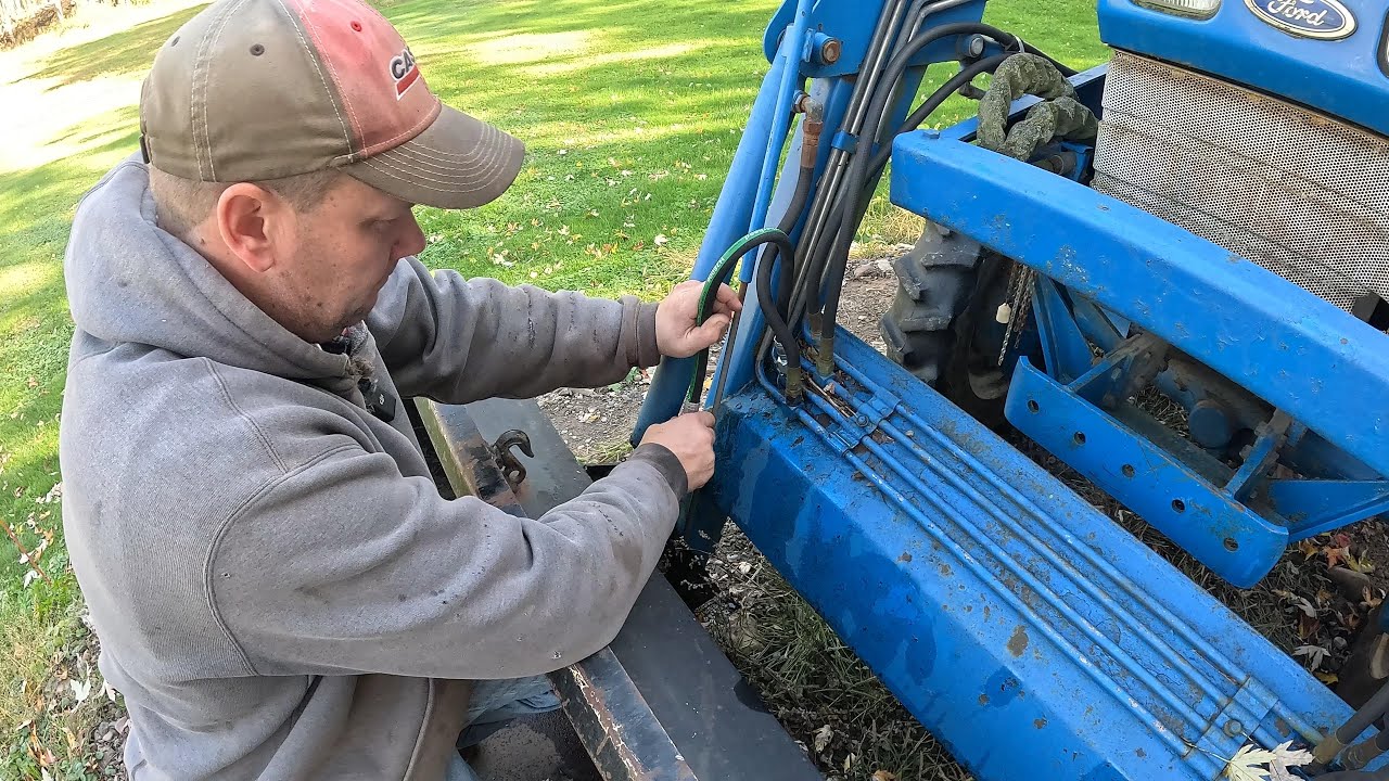 How to replace loader hoses and an oil change on the Ford compact ...