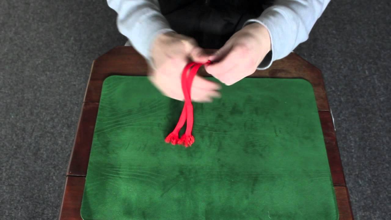 Ring through rope Ring penetration rope magic Close up magic trick ...