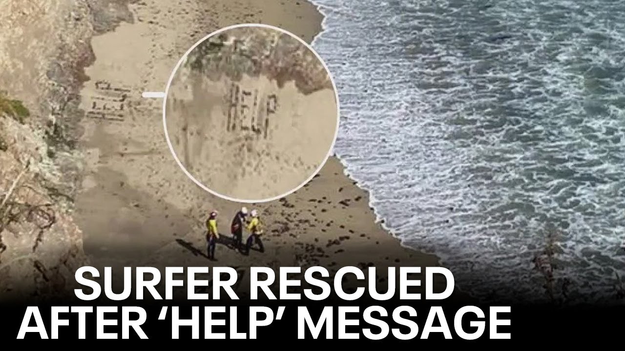 'HELP': Kite surfer rescued after using rocks to spell out 'HELP ...