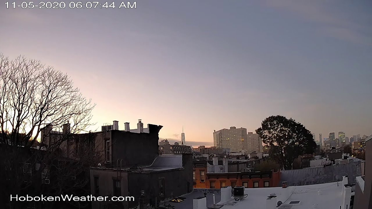 Clouds stream by One World Trade Center during sunrise - Nov 5 2020 ...