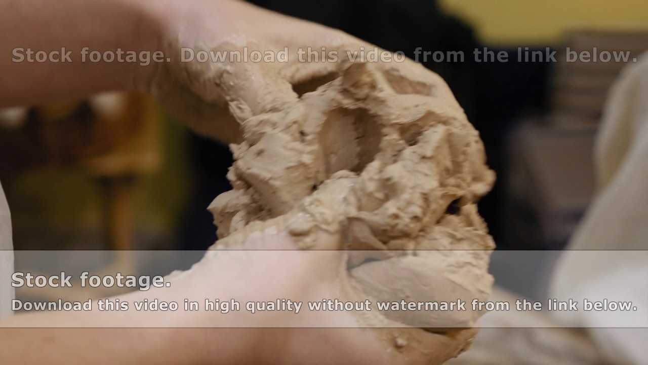 Sculptor is pugging clay for creating pottery - YouTube