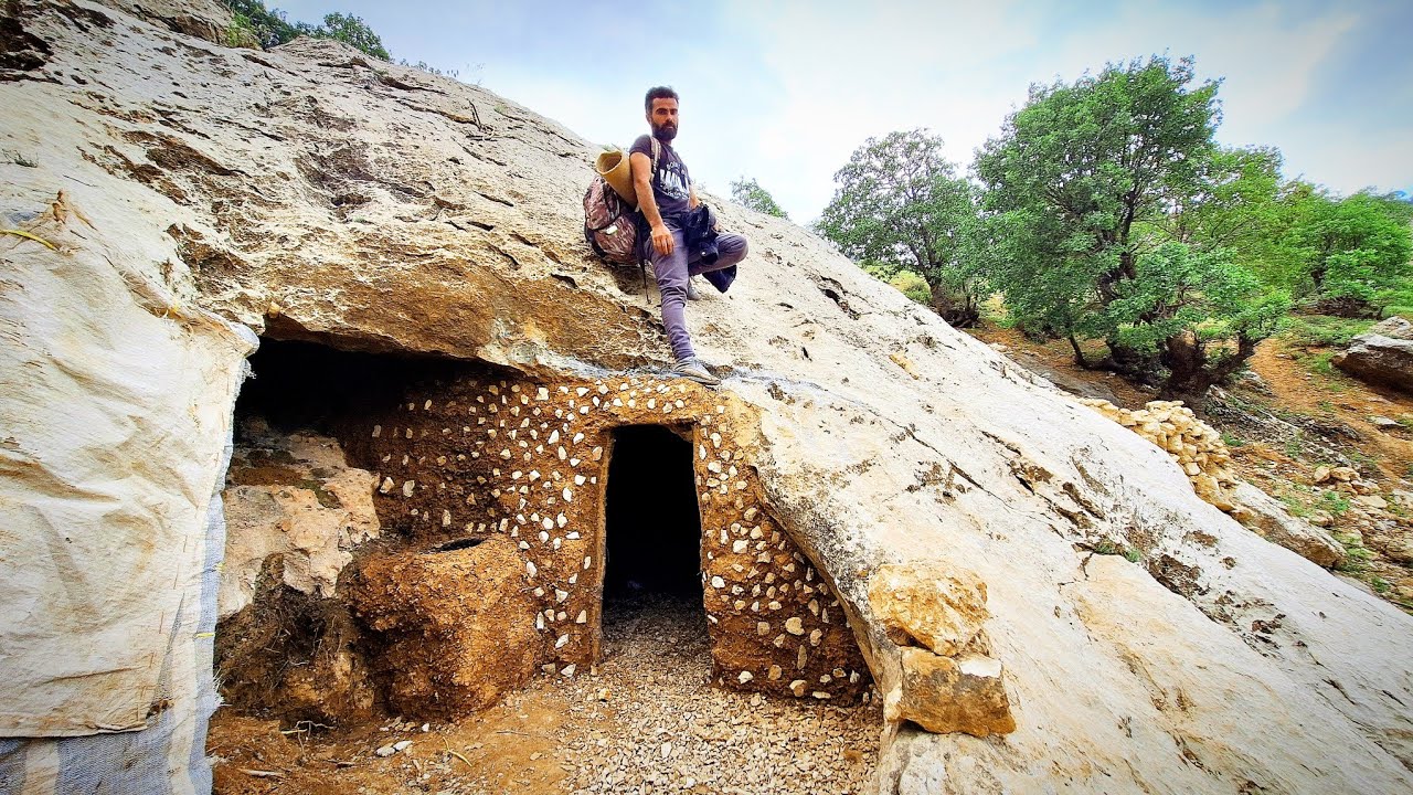 I built a cave with a fireplace. Camping in the mountains. Outdoor ...