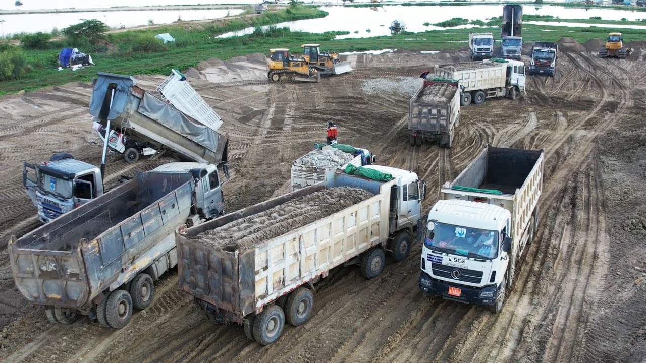 Huge Sand Group Wheel Loader and Bulldozer Pushing Clearing Sand Dump ...