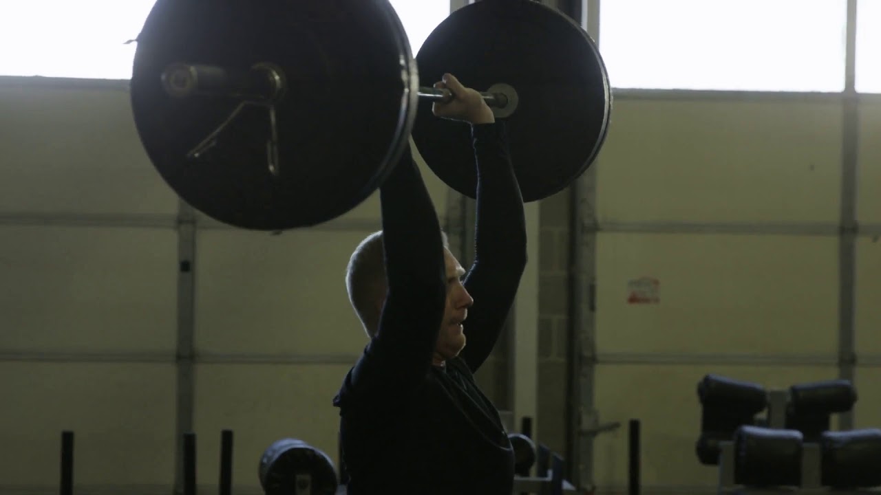 slow motion man exercising with weights - YouTube