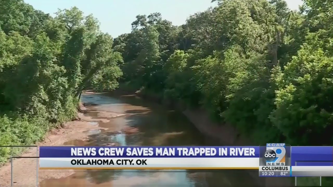 News crew saves man trapped in river - YouTube