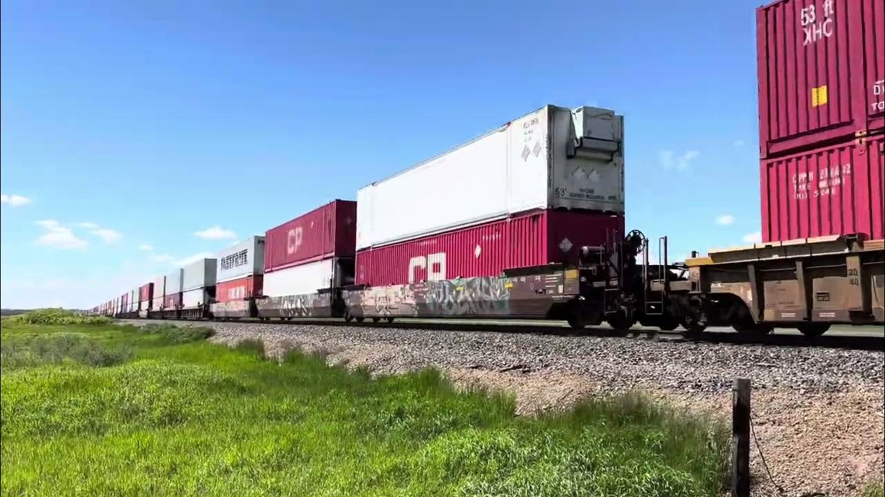 Beautiful K5HL ! CP 8929 leads a CPKC intermodal east on the Brooks sub near Strangmuir, AB ...