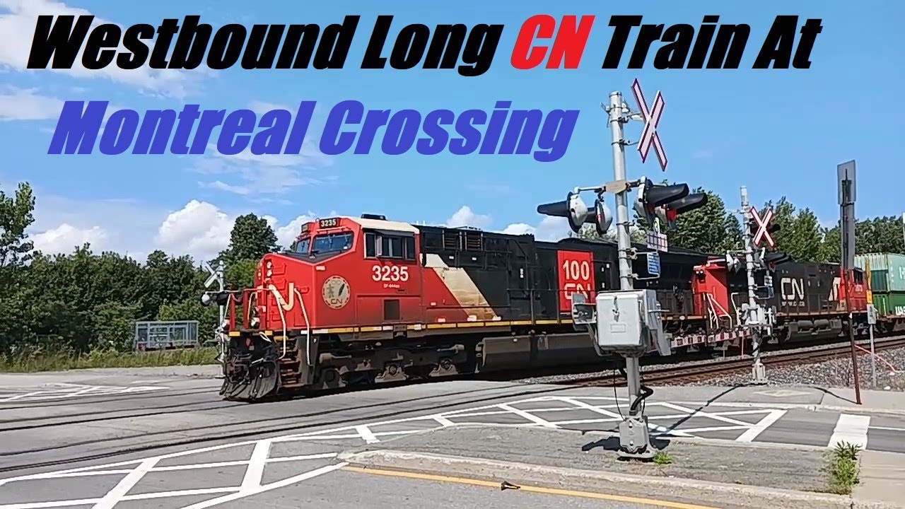 8 26 24 WESTBOUND LONG CN TRAIN AT MONTREAL LEVEL CROSSING IN ST HENRI ...