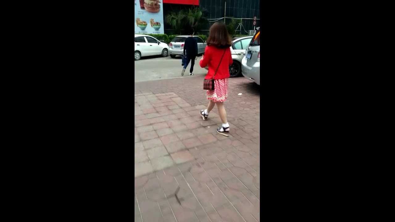 Girl In Frilly White Ankle Socks With Wedged Sandals Walking In Street