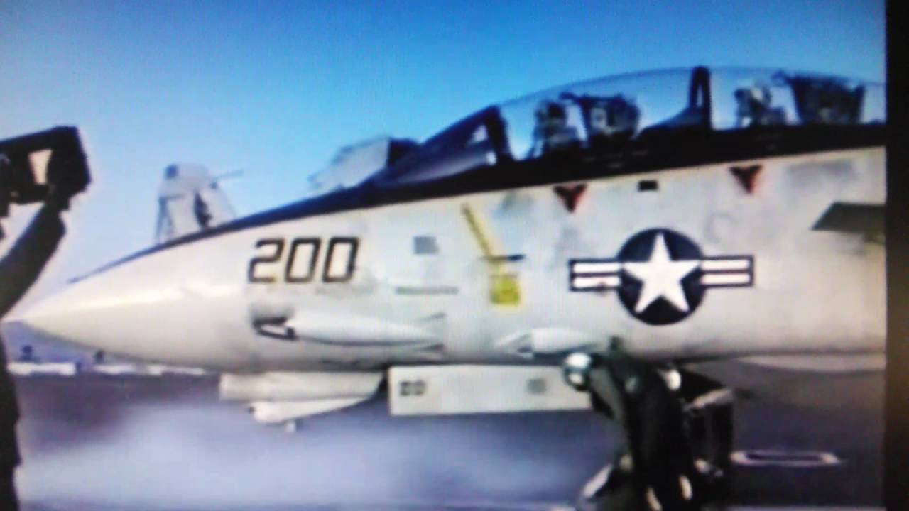 Aircraft carrier flight deck operations full afterburner launch of F-14 ...