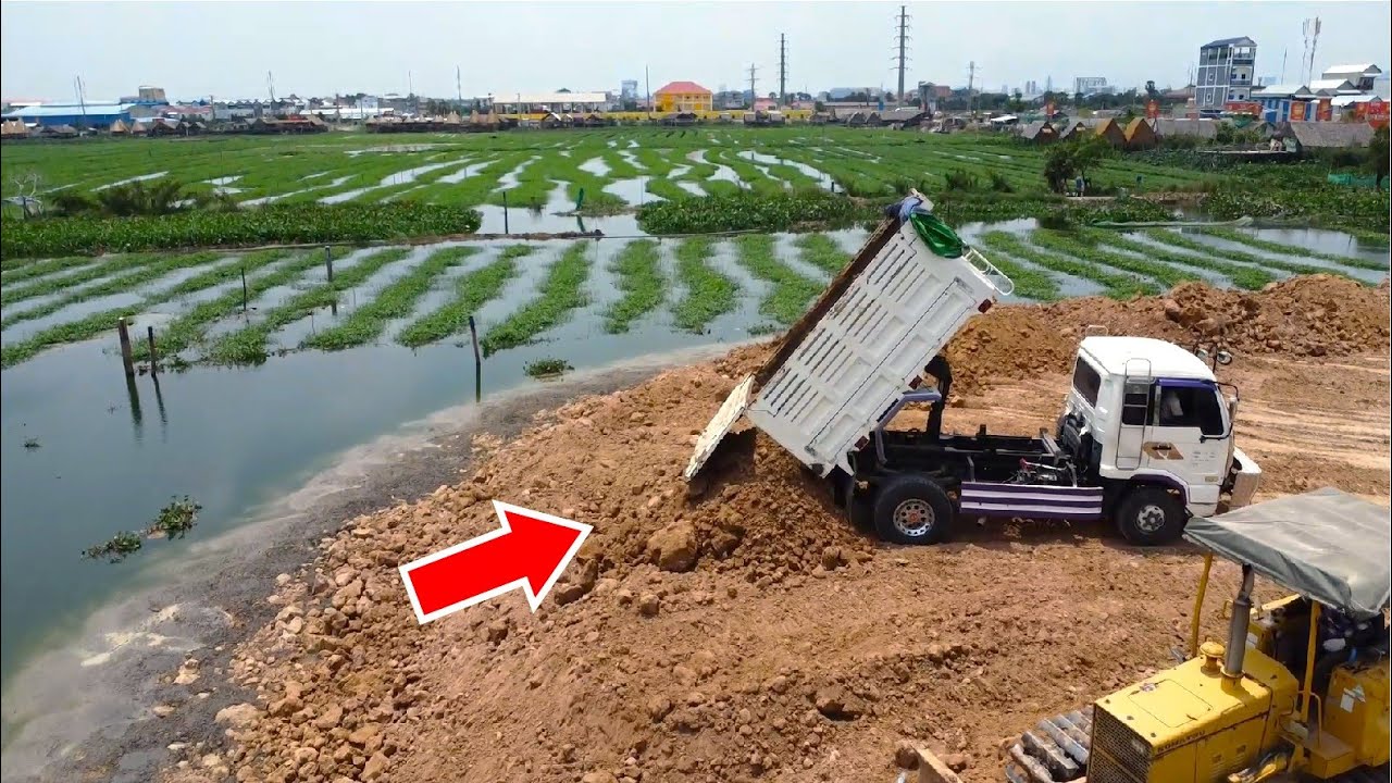 Filling Land Bulldozer Work Leveling & Grading Soil in to lake. - YouTube