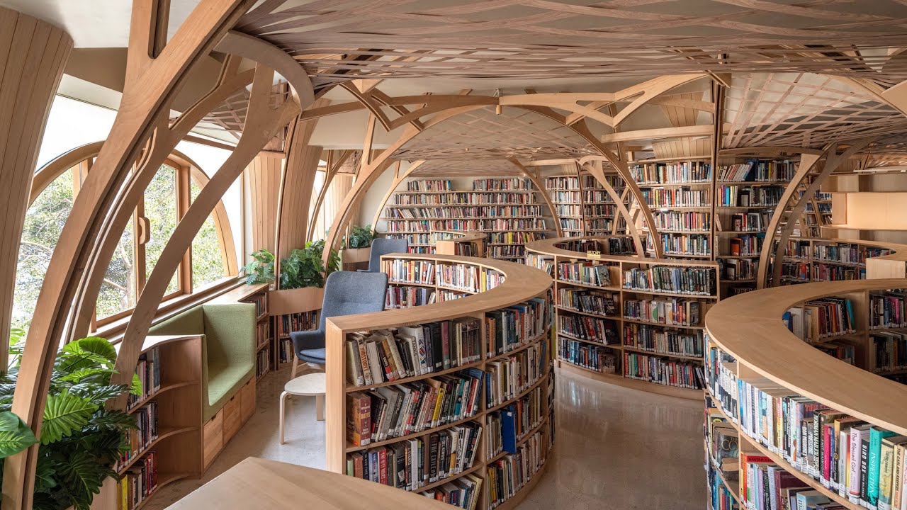 Studio Hinge creates library spaces beneath tree-like wooden columns ...