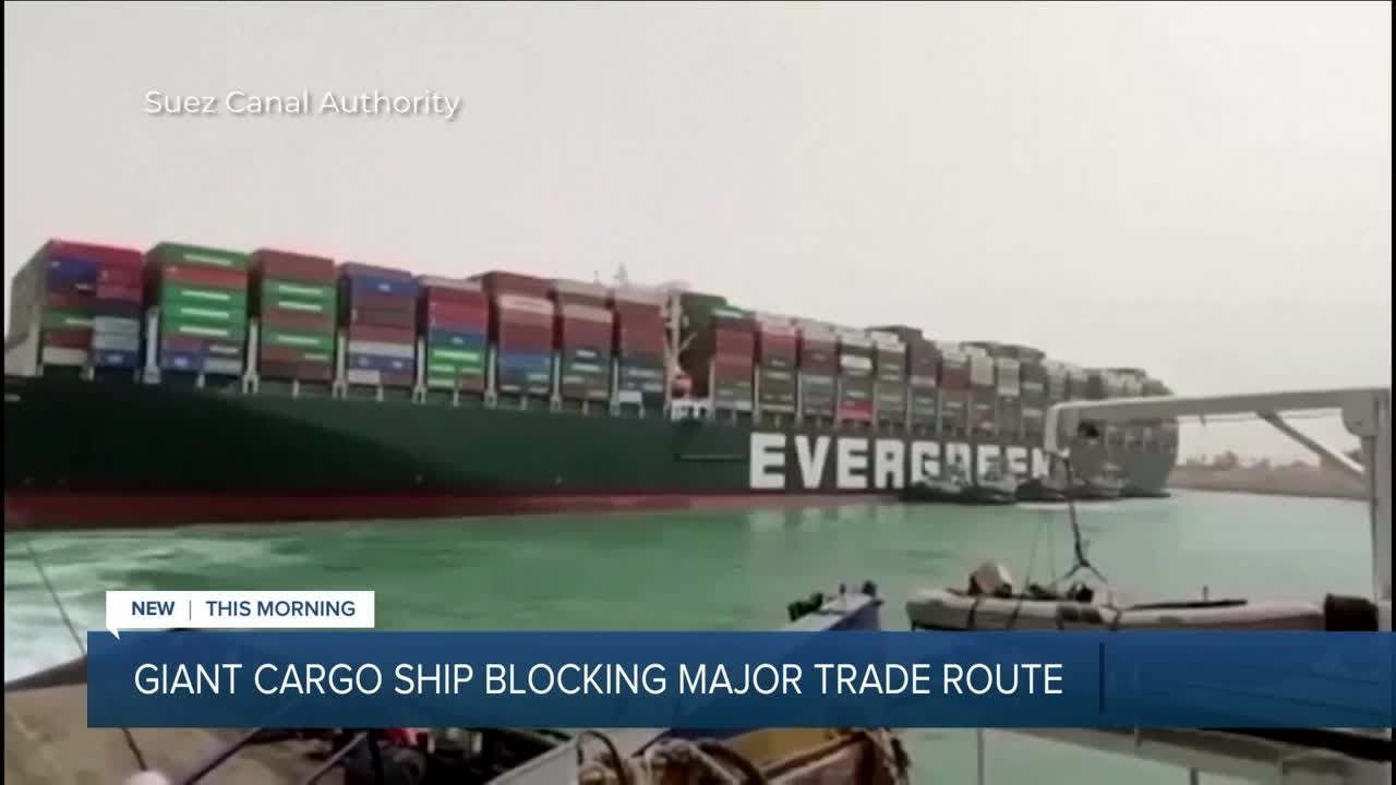 Giant cargo ship blocks Suez Canal - YouTube