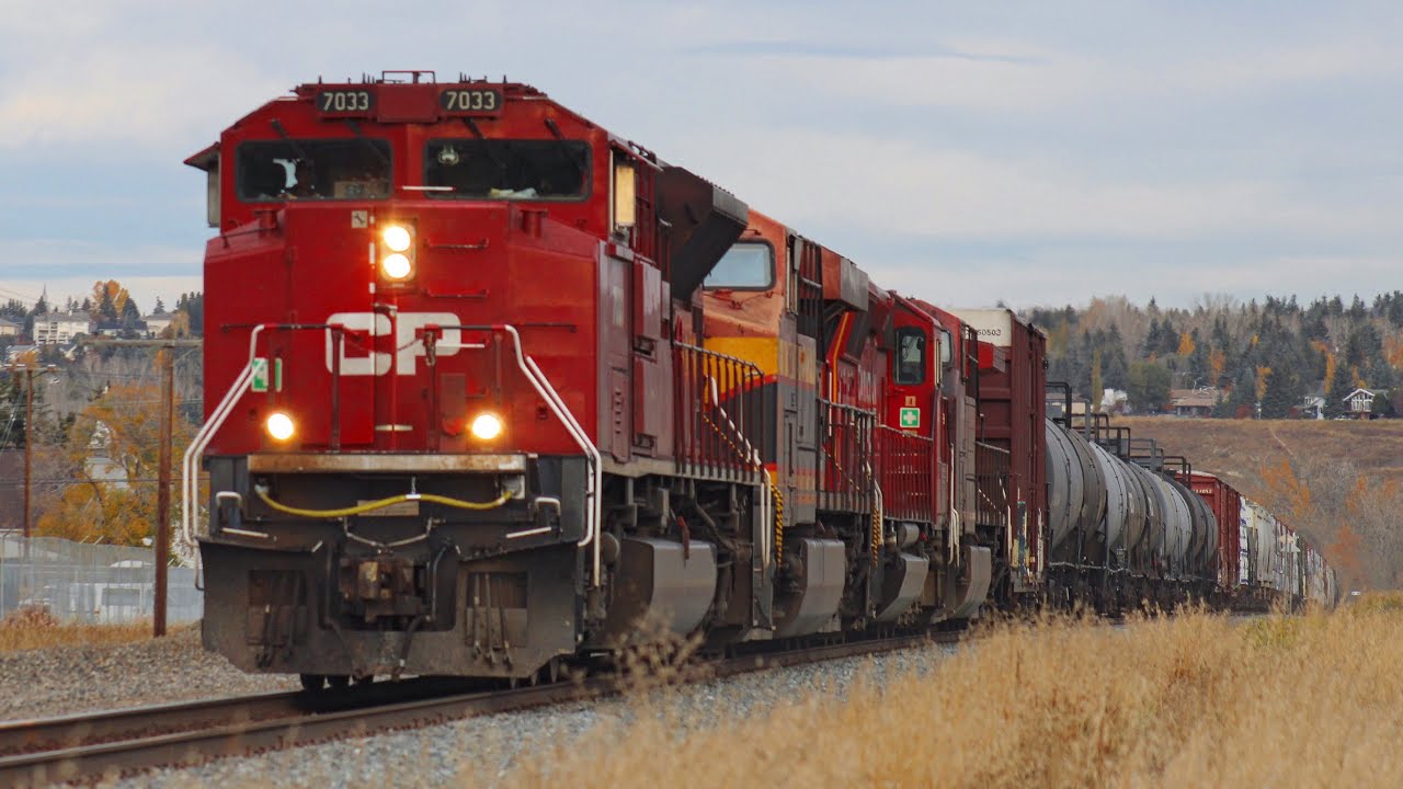 CP 7033 SD70ACU leading CP freight train with a nice lash up. East at Brickburn on the Laggan ...
