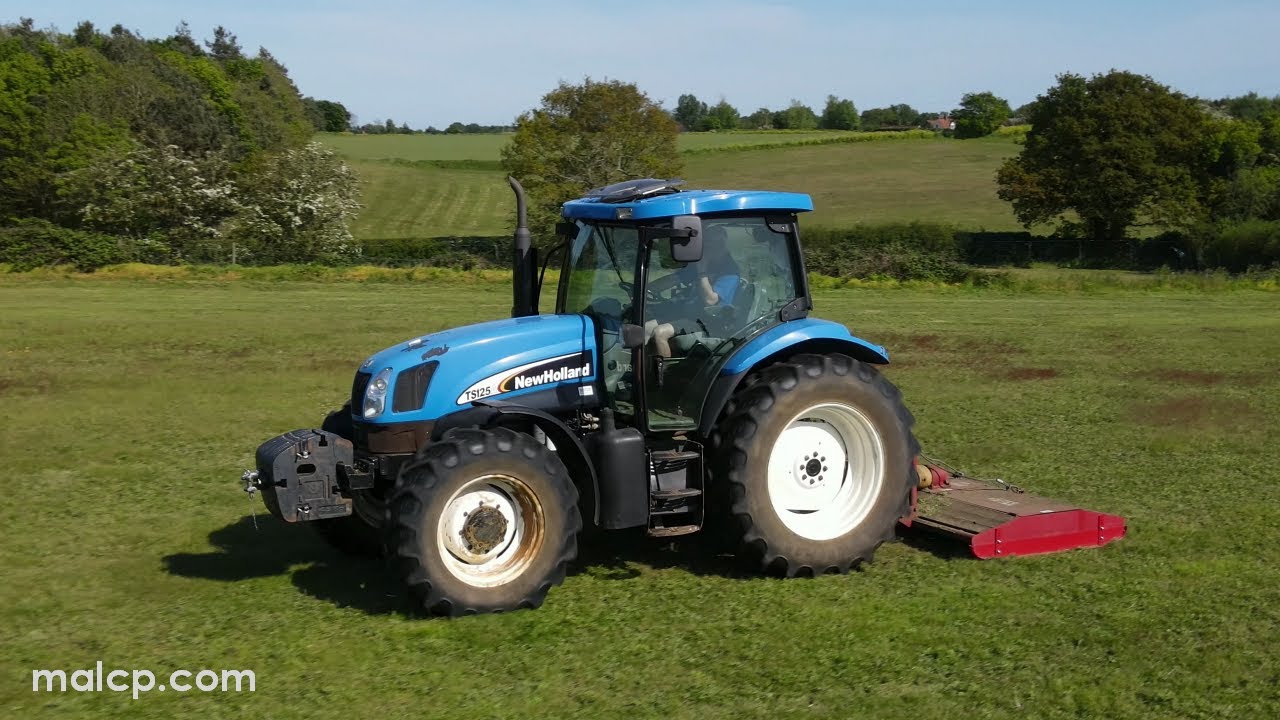 4k New Holland TS125 & Votex 3m topper mowing the spectator's carpark ...
