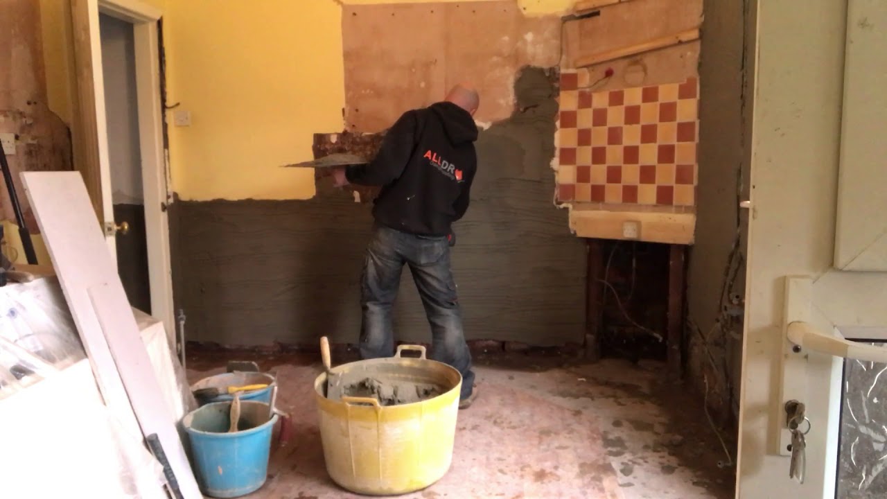 Applying Renderlite salt inhibiting plaster after DPC installation ...