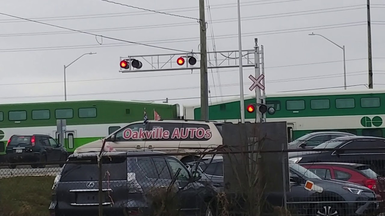 GO Transit Train Going Through A Railroad Crossing In Oakville Ontario ...