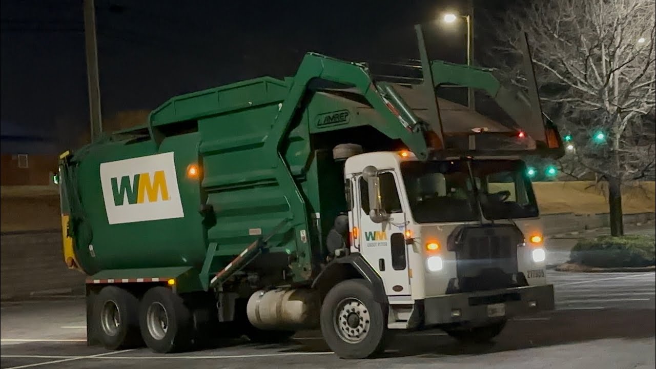 Waste Management Pete 520 Amrep front loader in the dark - YouTube
