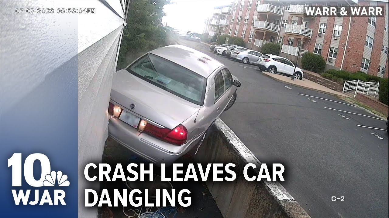 Crash leaves car dangling over table - YouTube