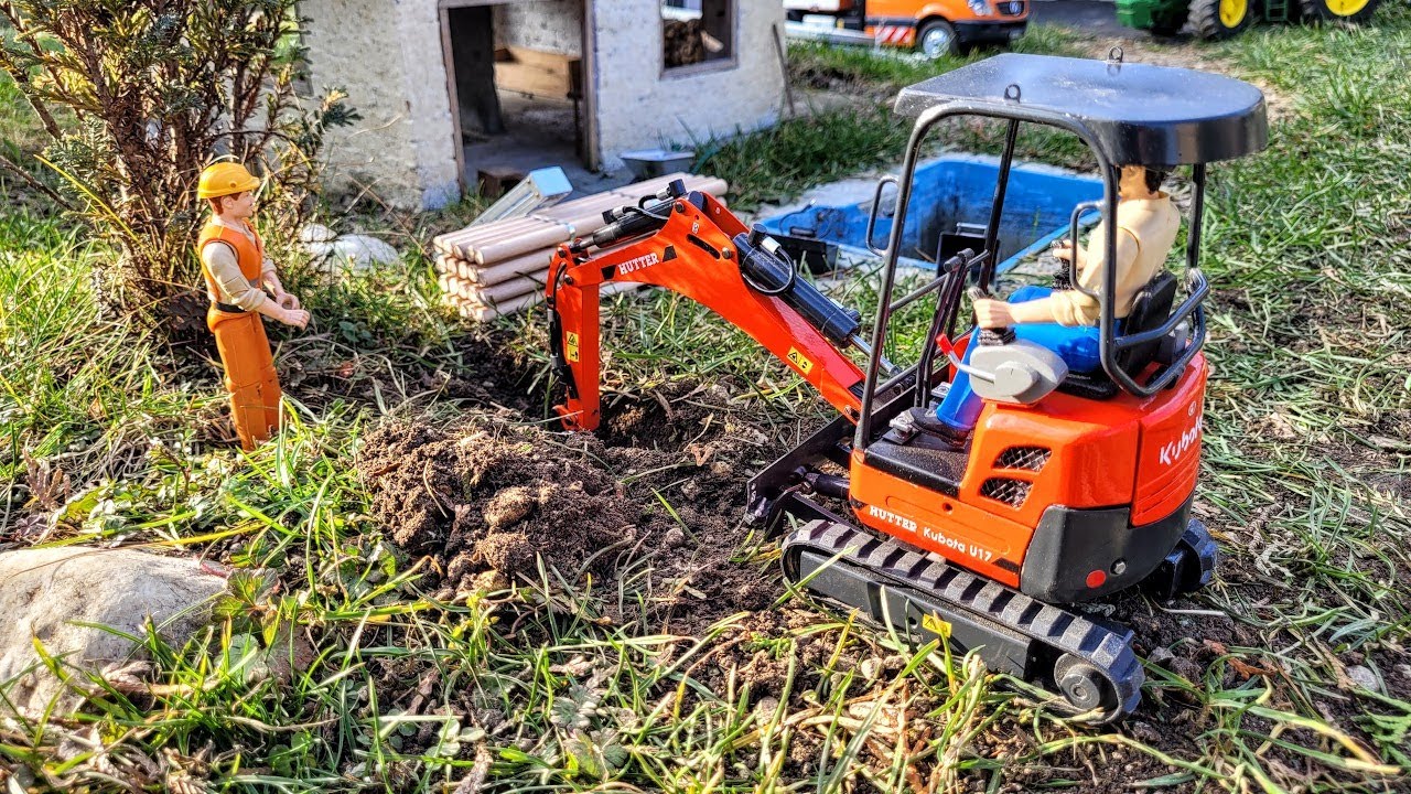 Thuya hedge removal and log palisade installation, RC mini excavator Kubota Hutter U17 - YouTube