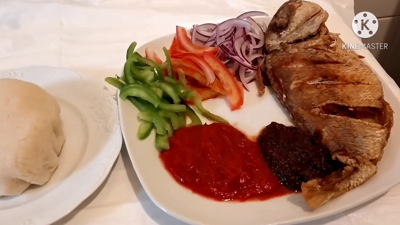 Fried Red fish with Banku with green bell pepper onion Tomatoes and ...
